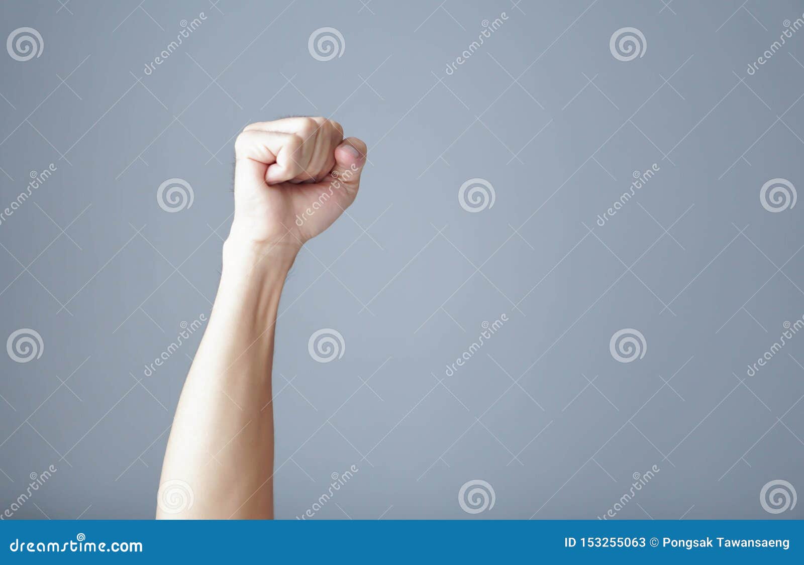 Man Hand with Clenched Fist on Grey Background Stock Image - Image of ...