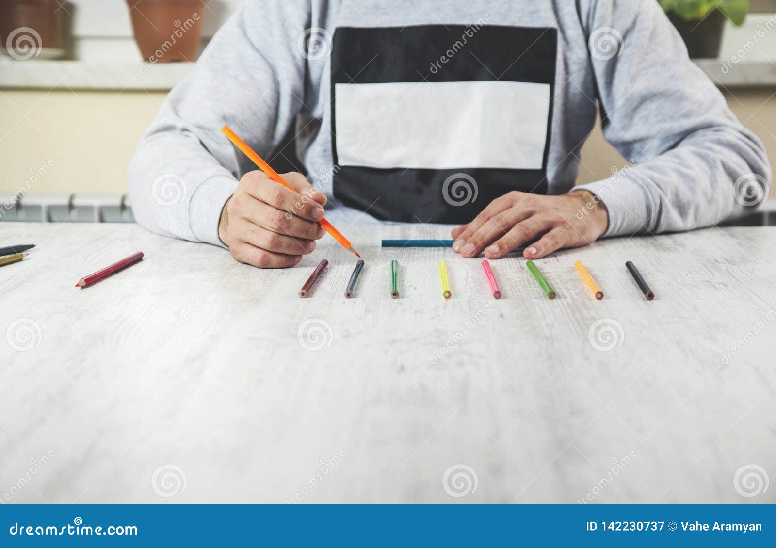 Man hand color pencils stock image. Image of education - 142230737
