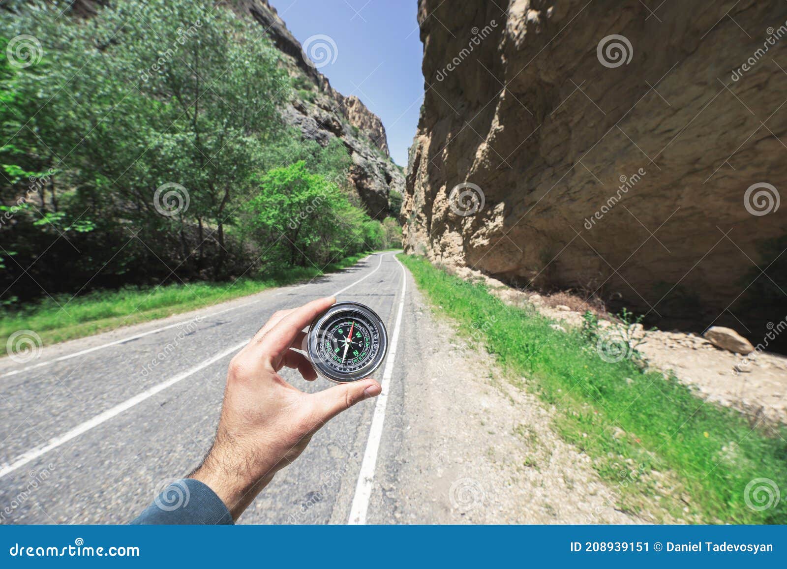 Man hand compass in road stock image. Image of adventure - 208939151