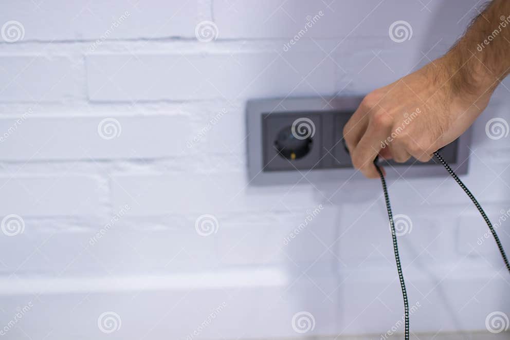 Man plugging appliances stock image. Image of hand, modern - 152152263