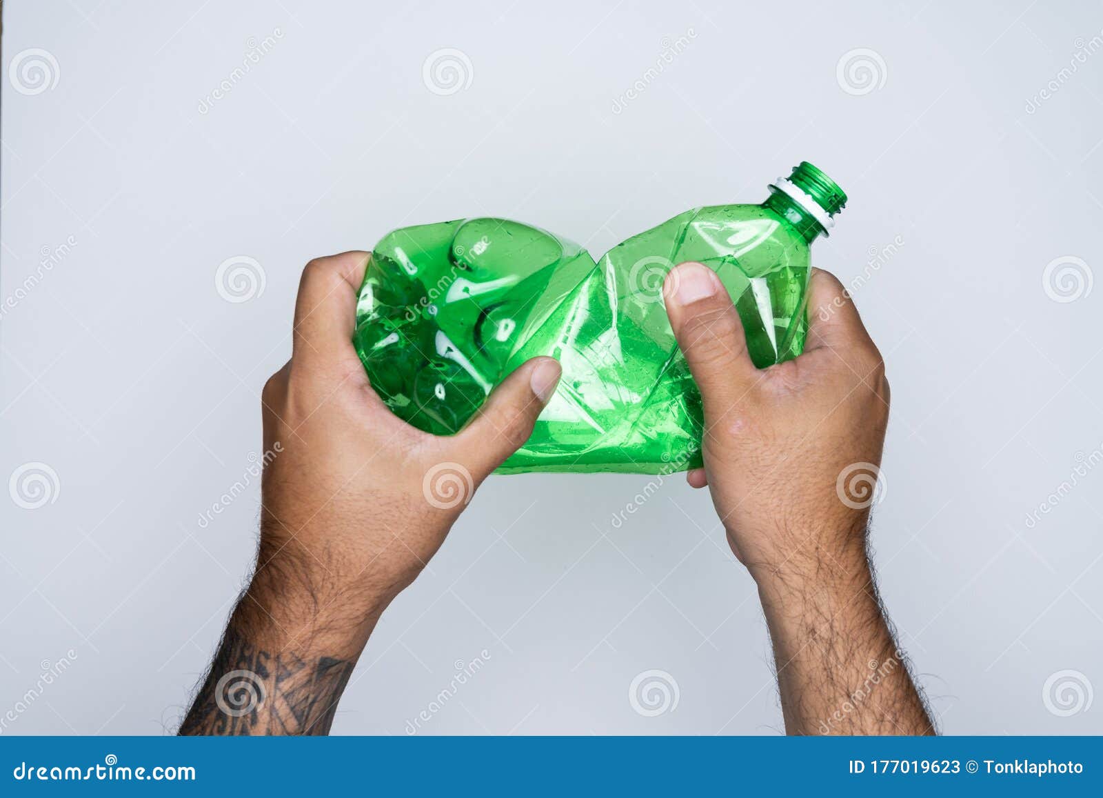 Man Hand Grab and Twist Plastic Bottle for Recycle. Eco System Stock ...