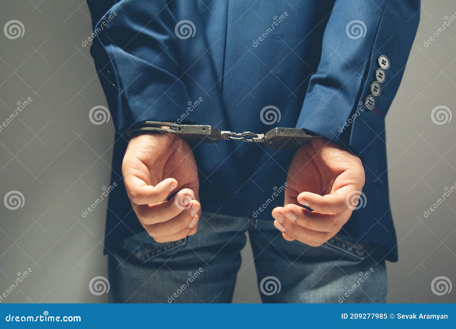 Man hand handcuffs in back stock image. Image of arrest - 209277985