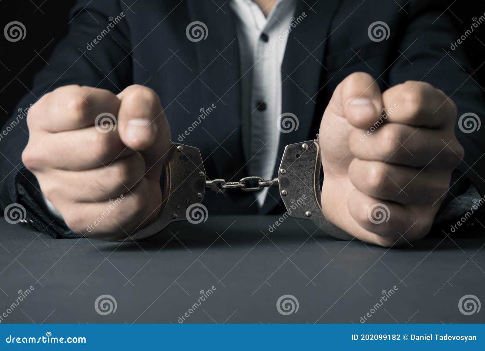 Praying Man In Handcuffs Stock Photo | CartoonDealer.com #30940578