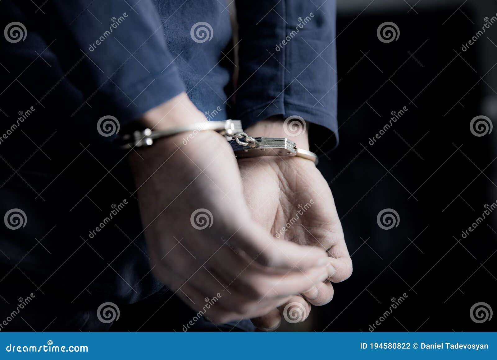 Man hand handcuffs stock photo. Image of handcuffed - 194580822