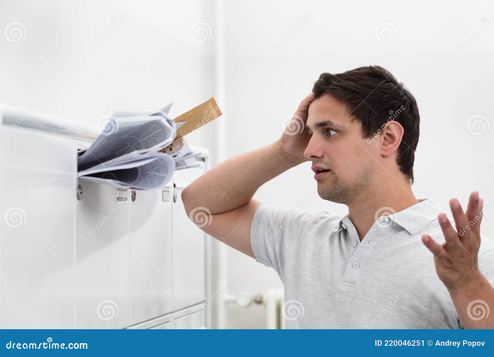 Man with Hand on Head in Front of Overloaded Mailbox Stock Image ...