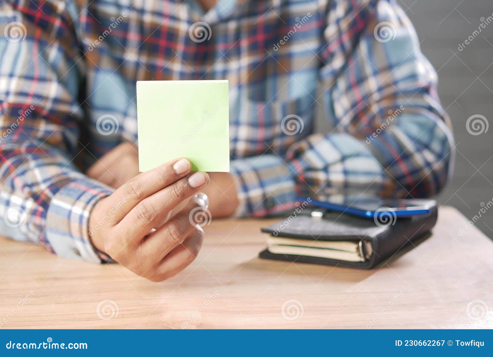 Man Hand Hold a Sticky Note while Sited Stock Image - Image of sticky ...
