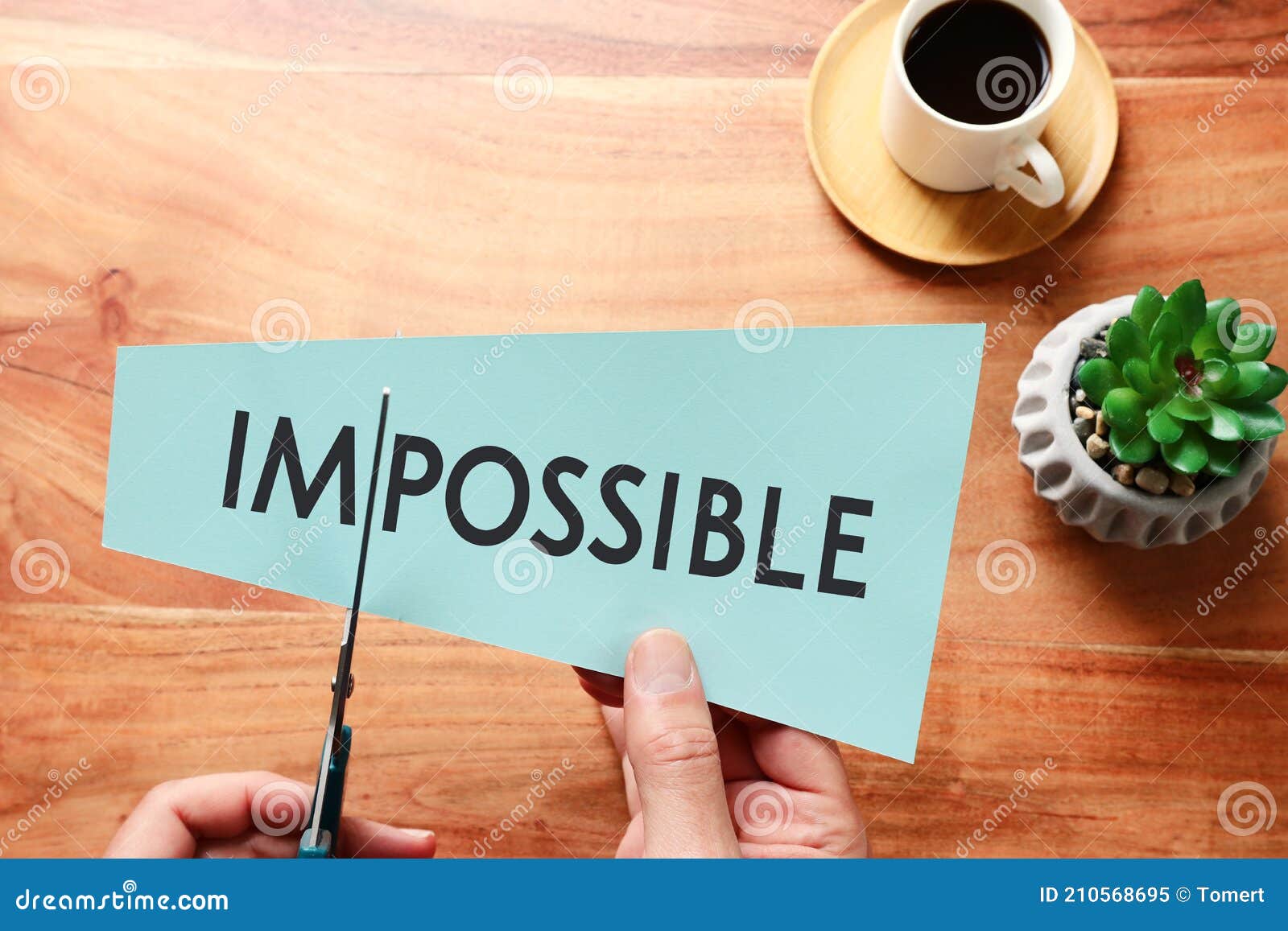 Man Hand Holding Card with the Text Impossible, Cutting the Word Im so ...