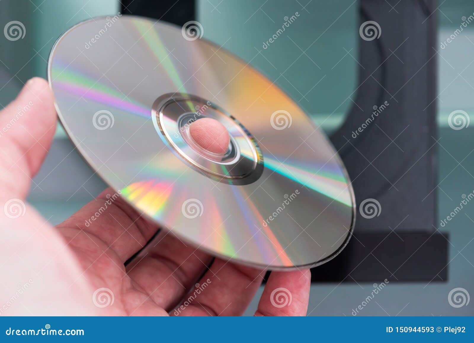 Man hand holding a CD stock image. Image of disc, blue - 150944593