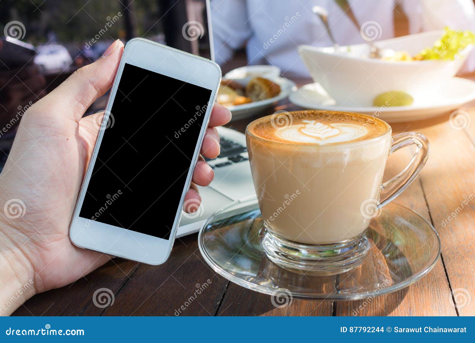 Man Hand Holding Cell Phone with Coffee in Restaurant. Stock Photo ...