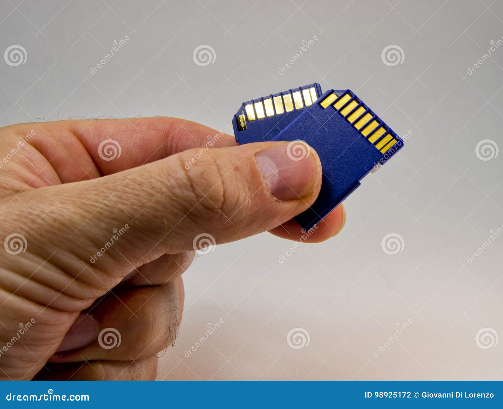 Man Hand Holding A Memory Card On A White Background. For Information ...
