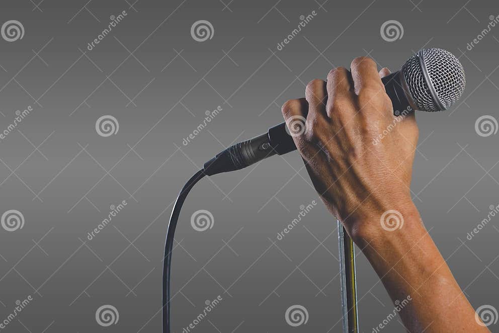 Man Hand Holding a Microphone on a Stand. the Microphone Clipping Path ...