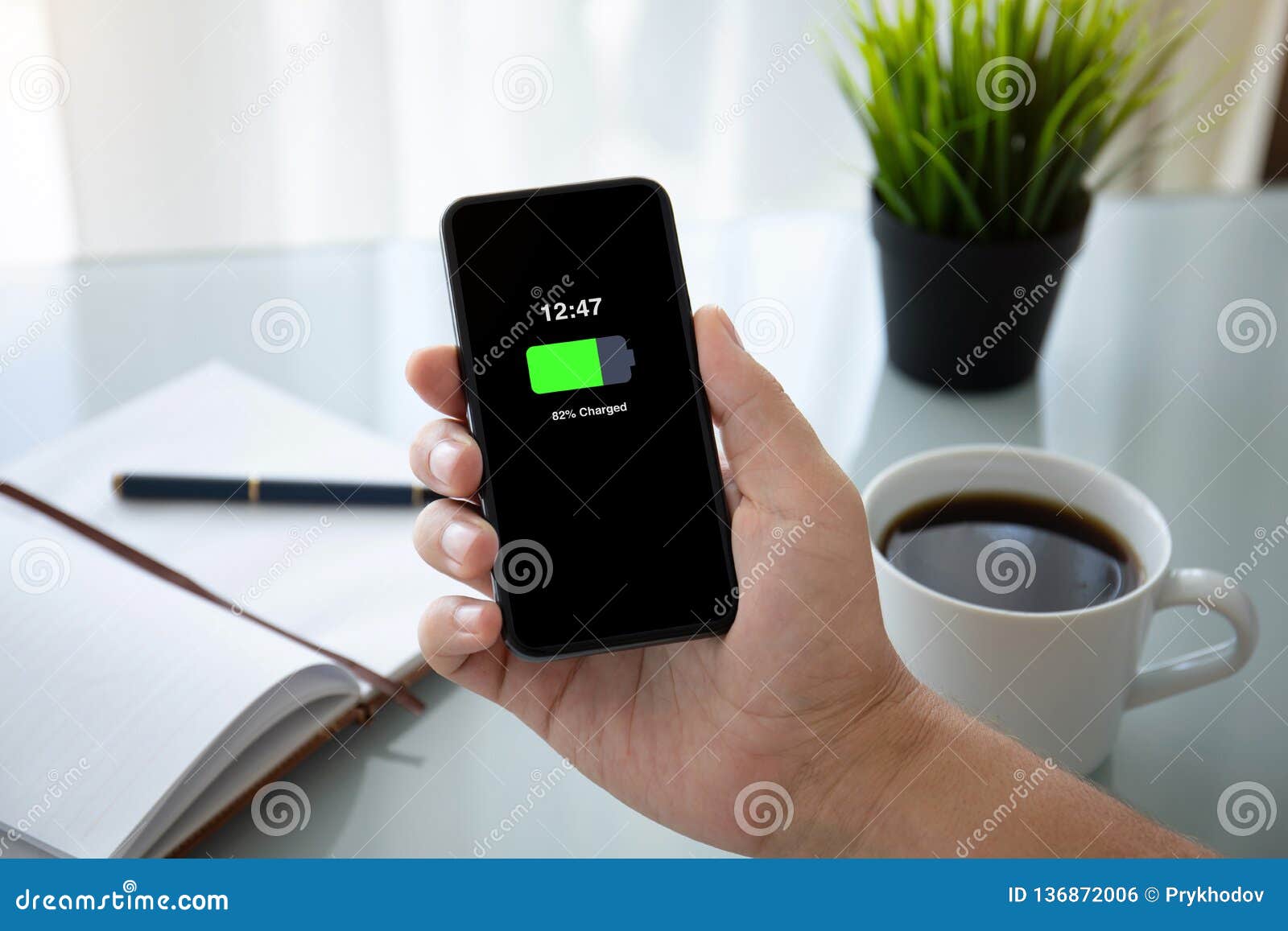 Man Hand Holding Phone with Charged Battery on the Screen Stock Photo ...