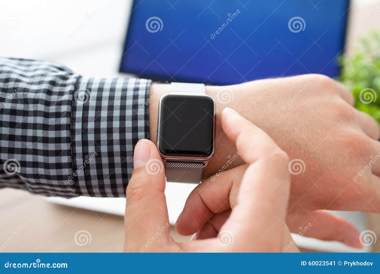 Man Hand Holding a Watch on the Background of Laptop Stock Image ...
