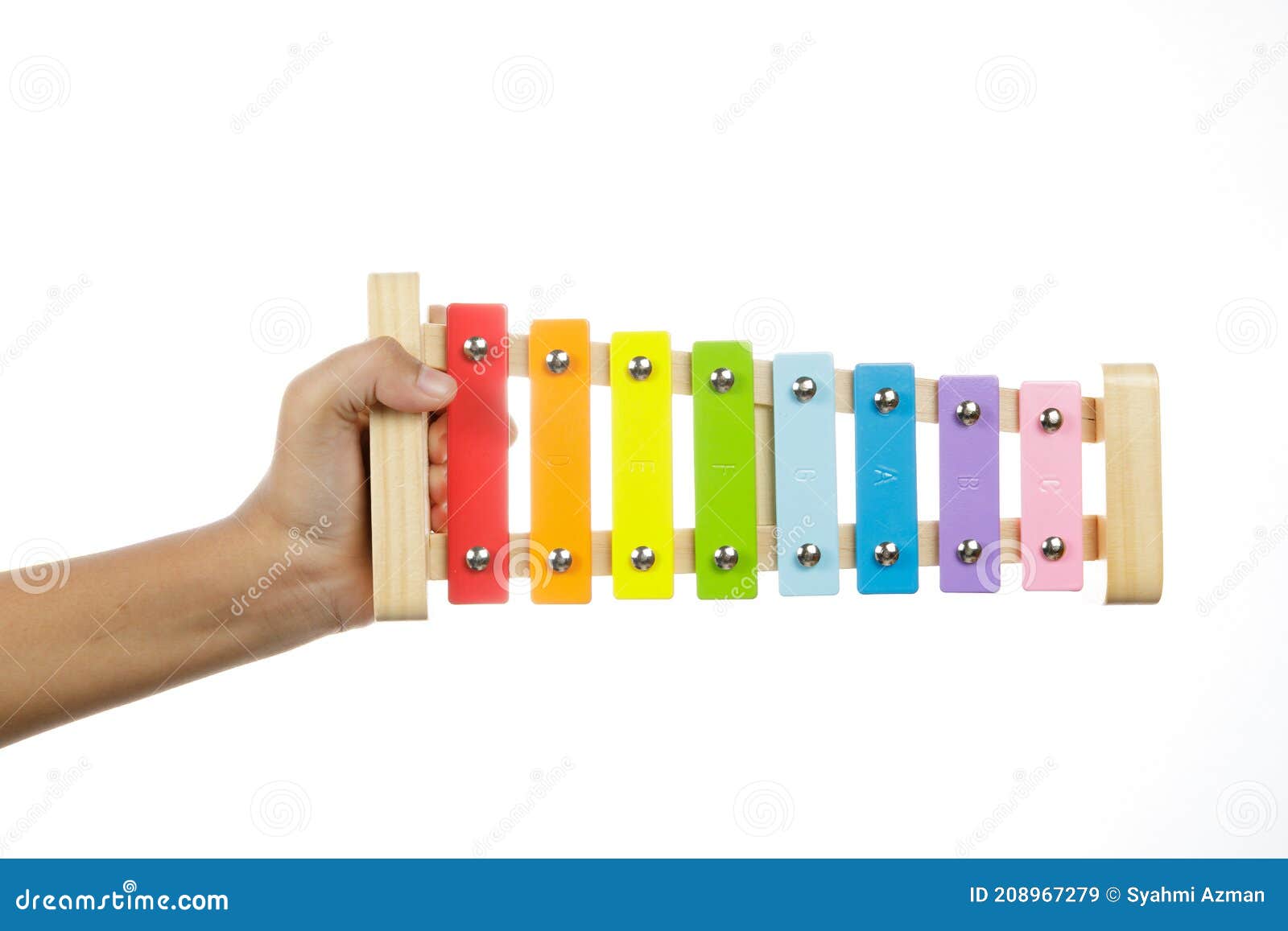 A Man Hand Holding a Xylophone Stock Image - Image of isolated, holding ...