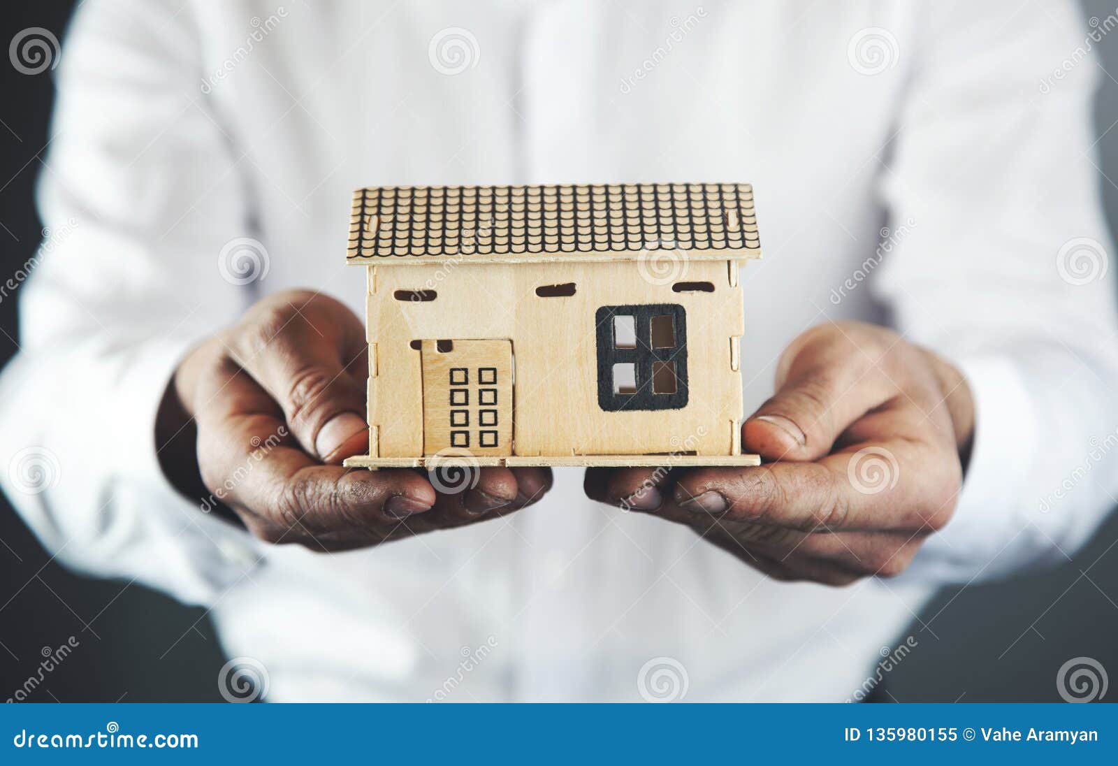 Man hand house model stock image. Image of property - 135980155