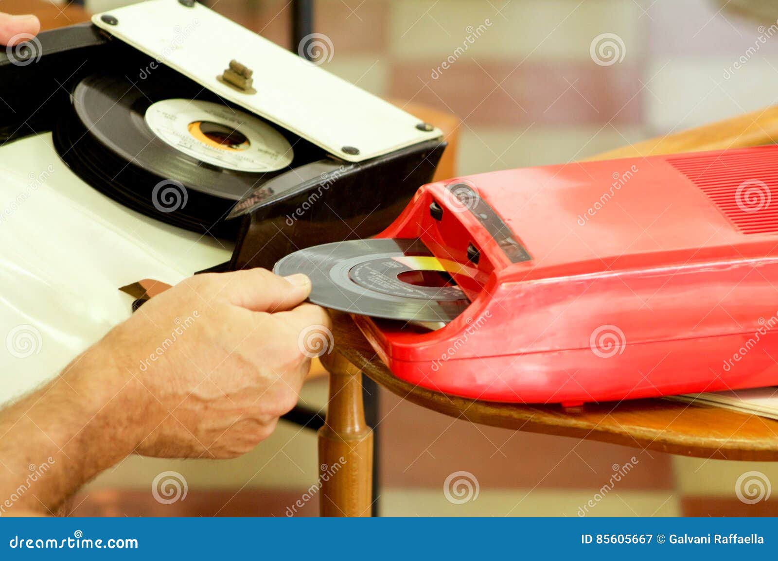 Man Hand Inserting Disc in a Vintage Device for Vinyl Records Stock ...