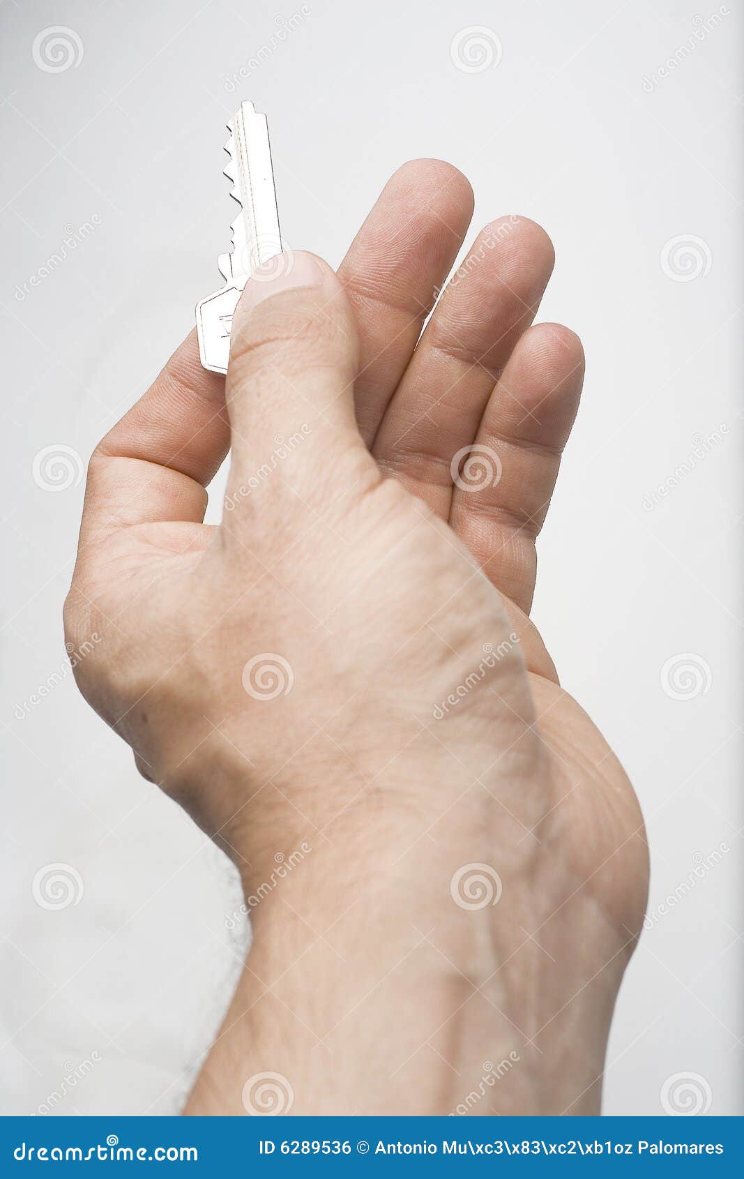 Man Hand and Key Over White Stock Photo - Image of life, activity: 6289536