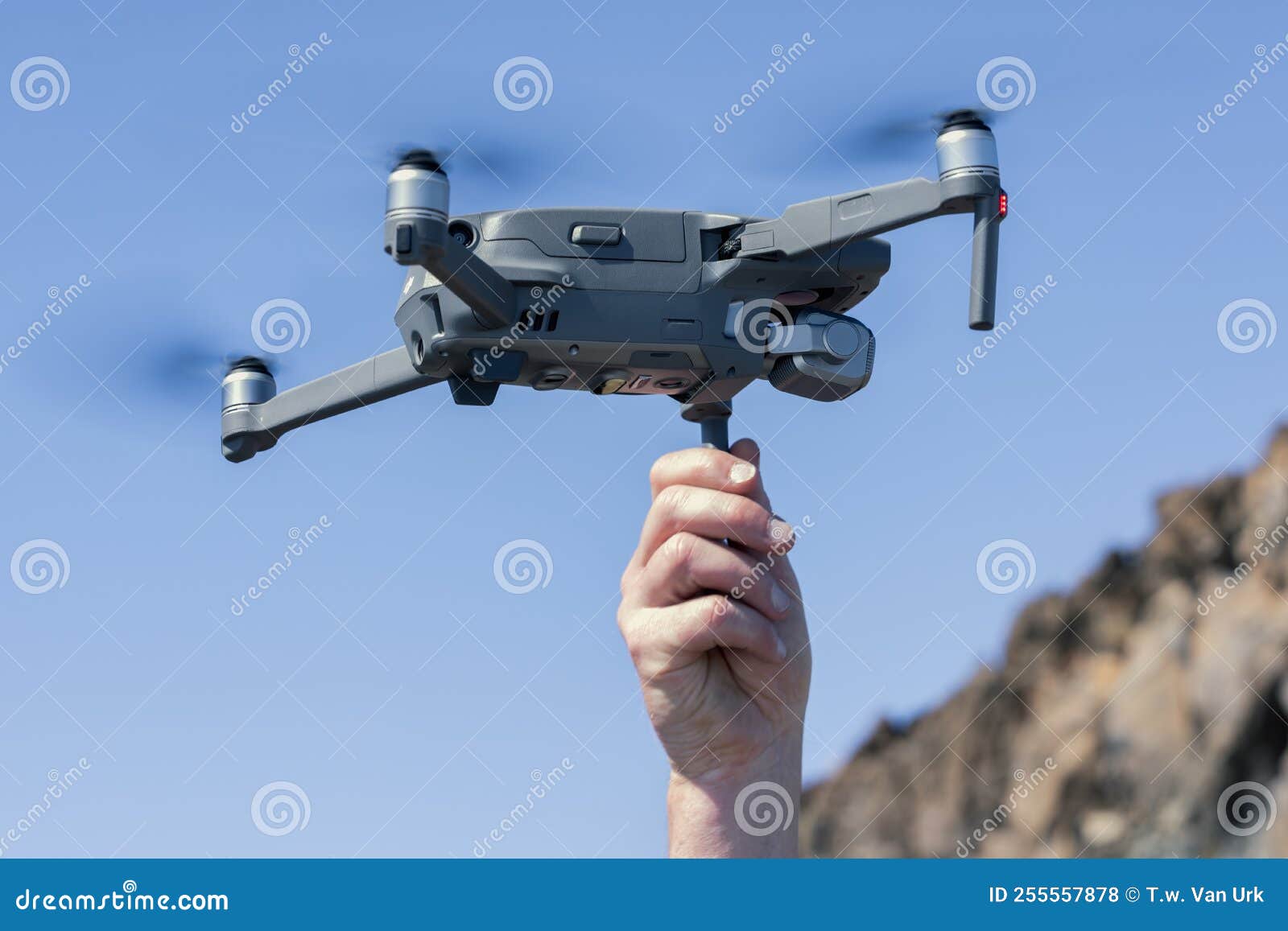 Man Hand Launching Drone Against Blue Sky Stock Photo - Image of ...