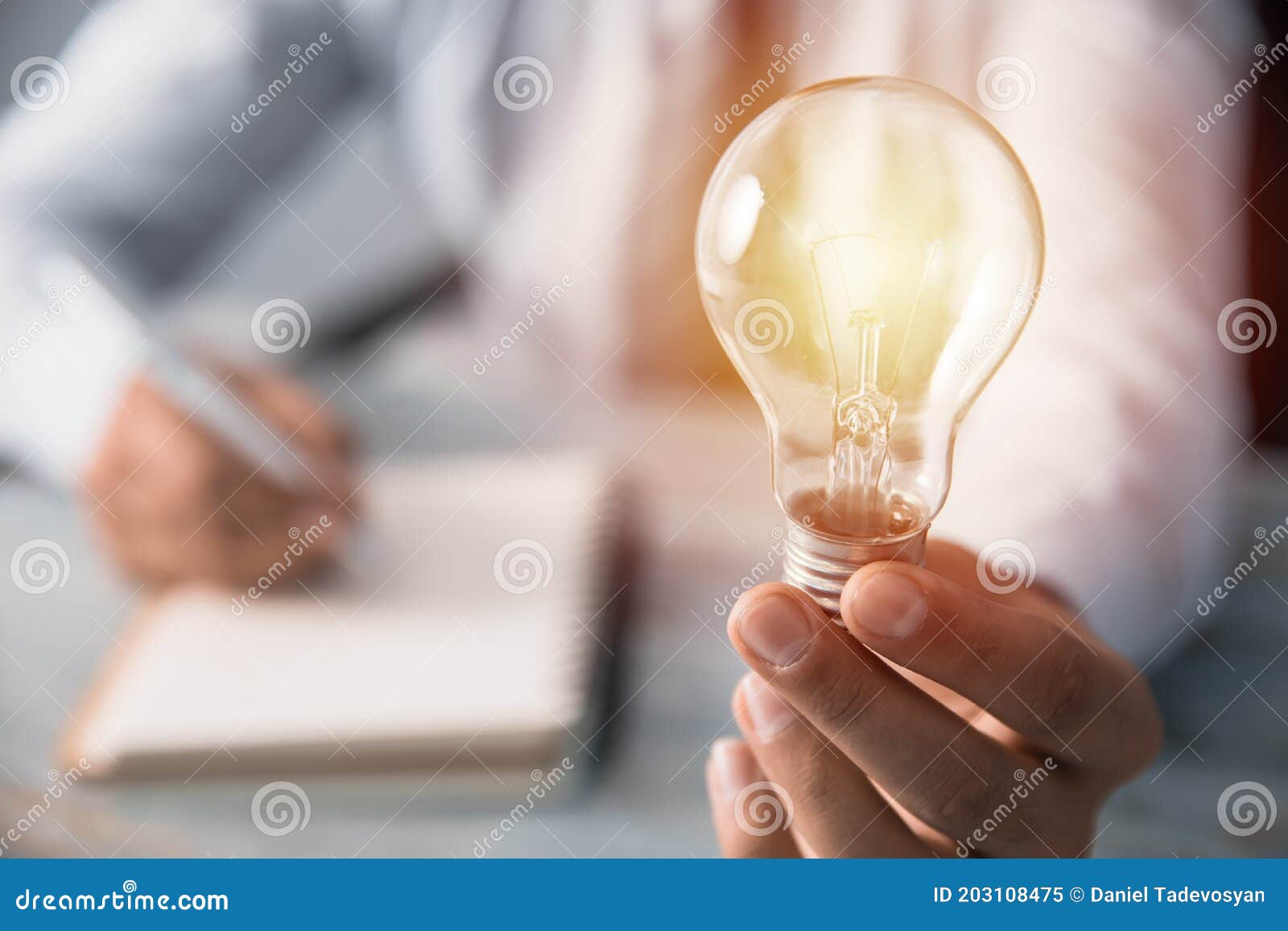 Man Hand Light Bulb with Notepad Stock Image - Image of exposure, think ...