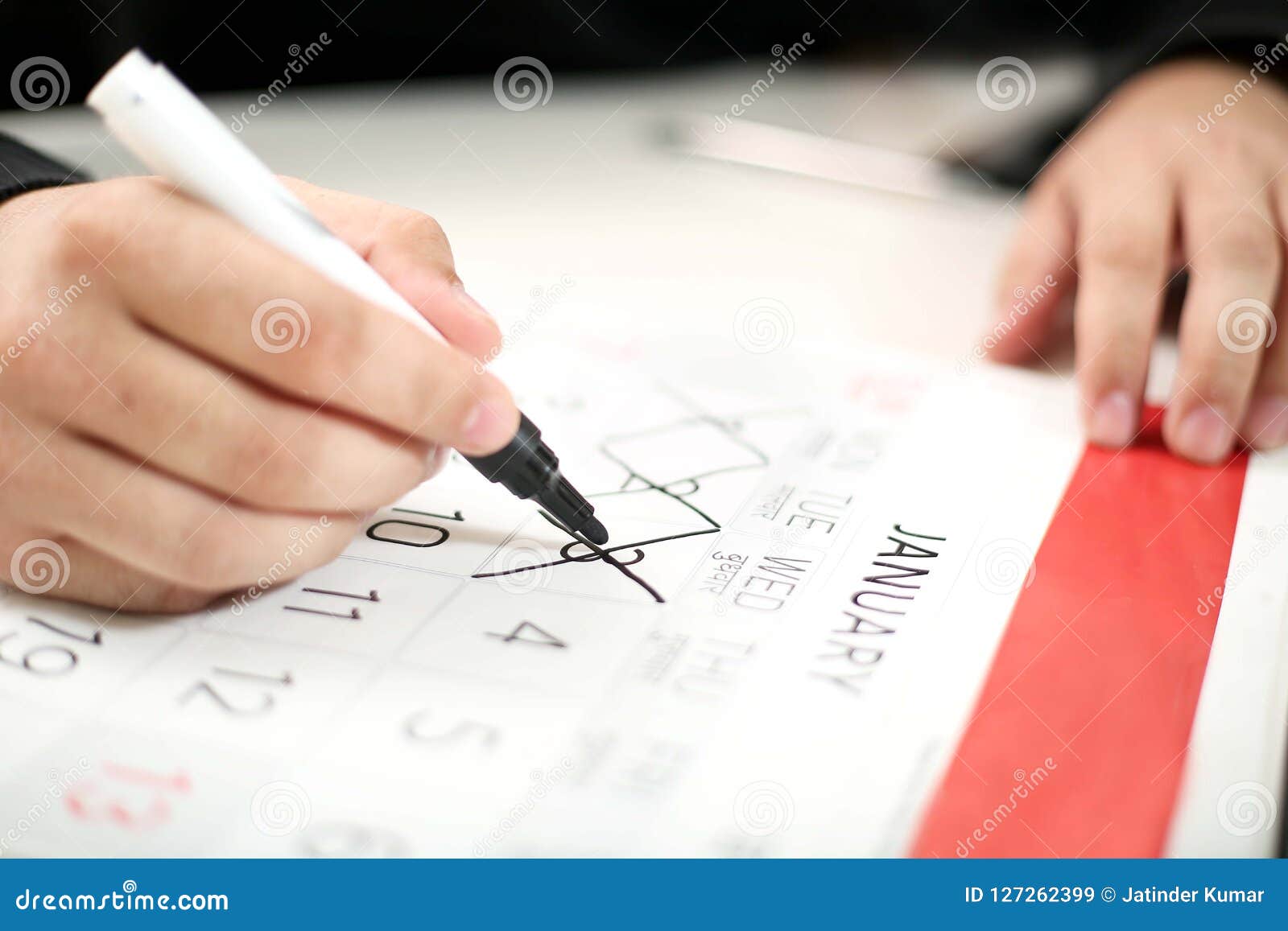 Man Hand is Marking Date on the Calendar with Marker Stock Image ...