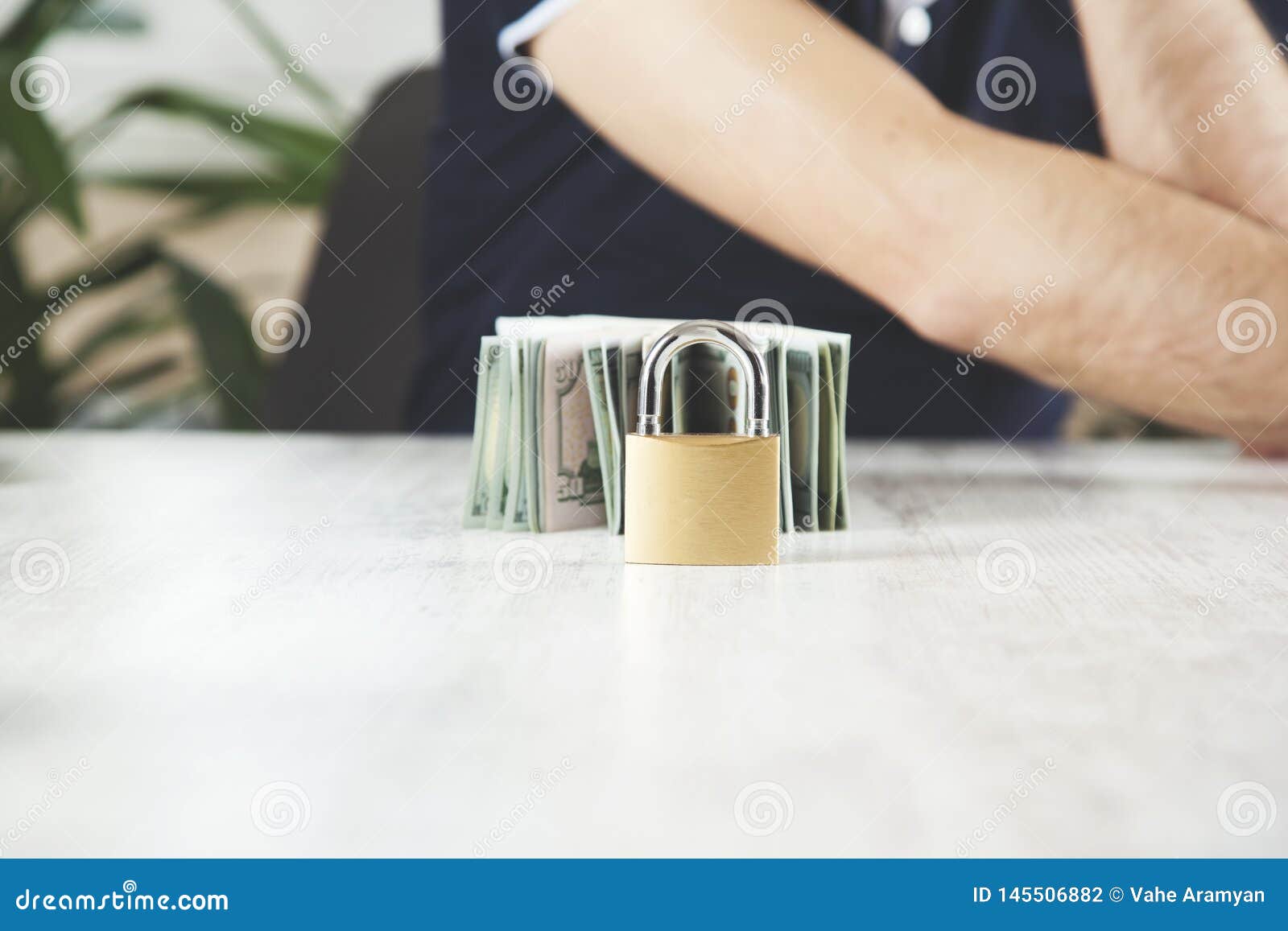 Man hand money with lock stock photo. Image of background - 145506882