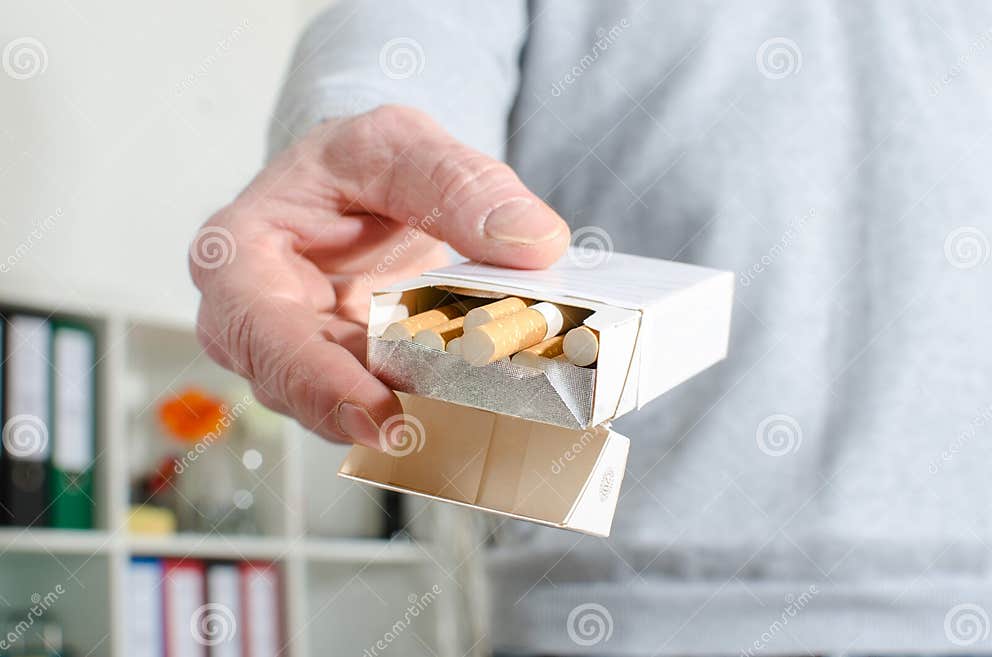 Man Hand Offering Cigarettes Stock Image - Image of habit, hand: 53942493