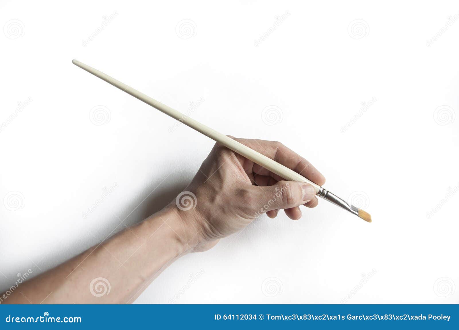 Man hand with paintbrush stock photo. Image of brush - 64112034