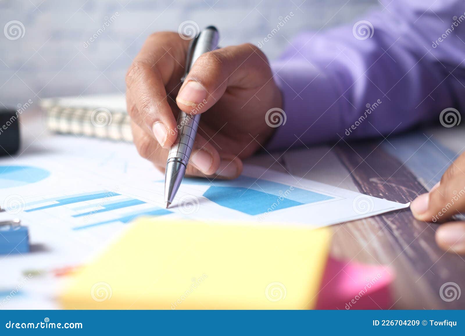 Man Hand with Pen Analyzing Bar Chart on Paper Stock Image - Image of ...