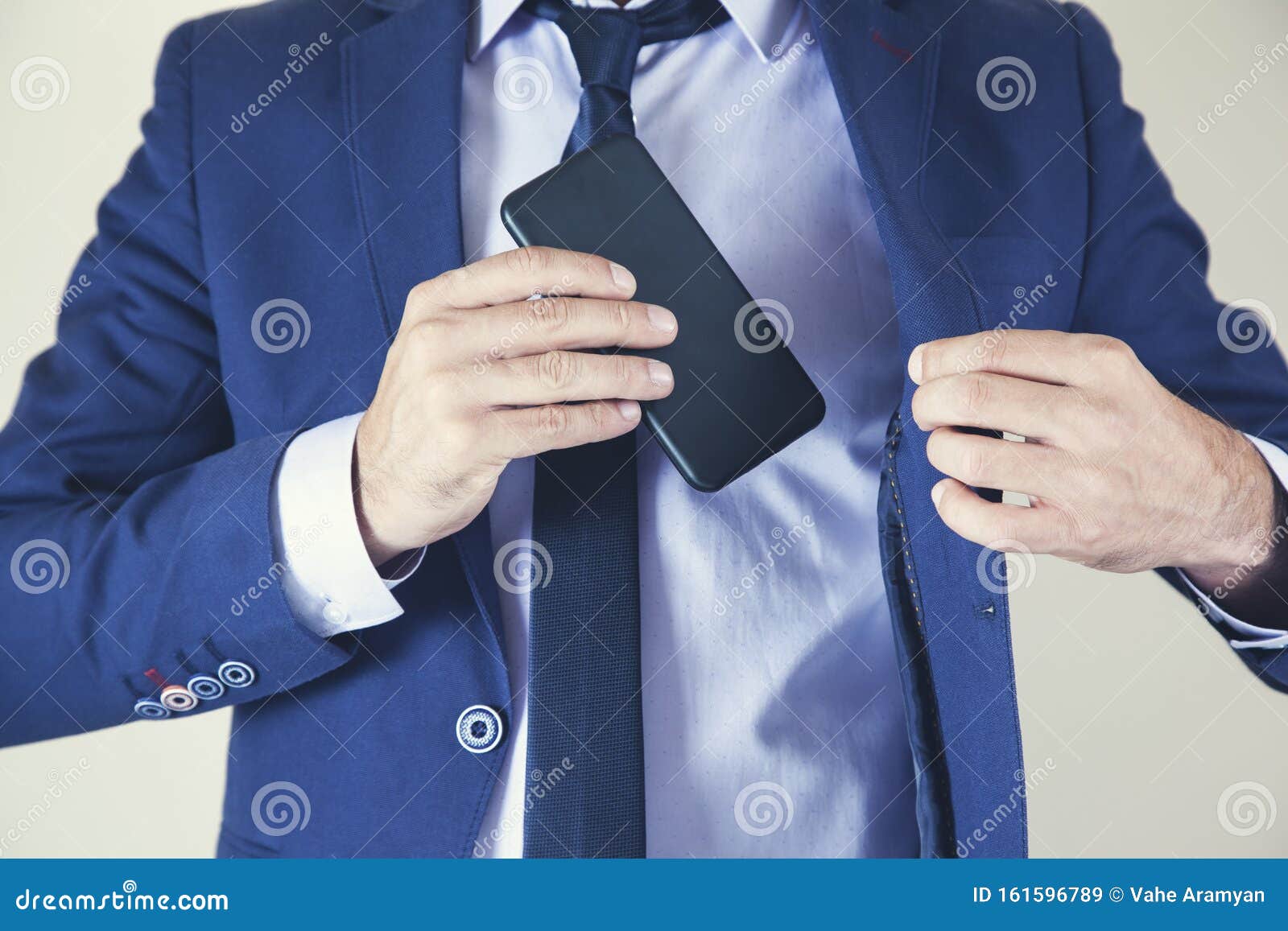 Man hand phone in pocket stock image. Image of pocket - 161596789