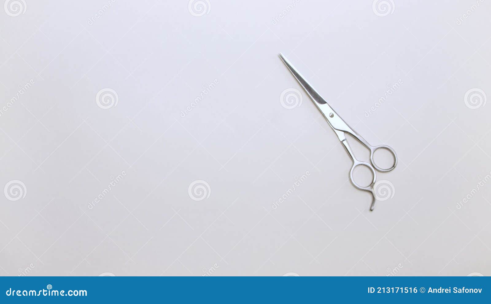 A Man Hand Places Large Scissors on the Table for Cutting and ...