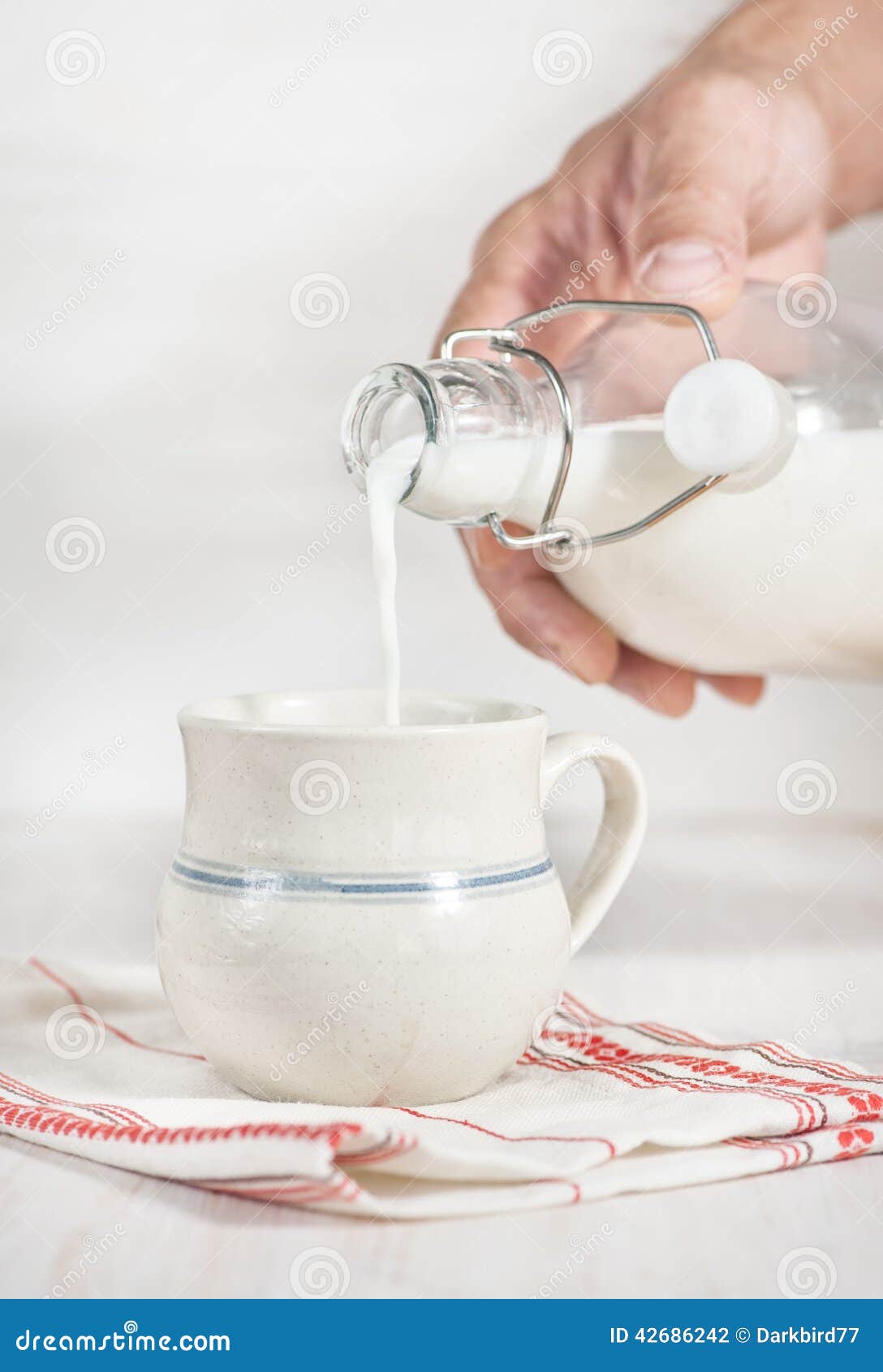 Man Hand Pouring Milk from Bottle Stock Photo - Image of clip, diet ...