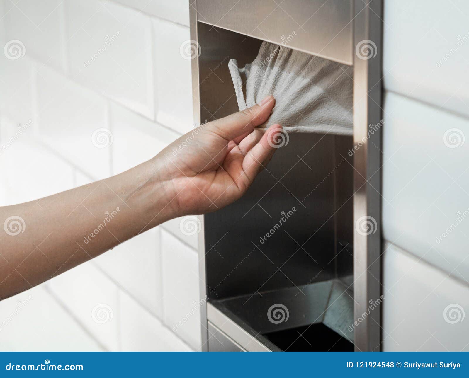 Man Hand Pulling a Tissue Paper from Tissue Box in the Restroom. Stock ...