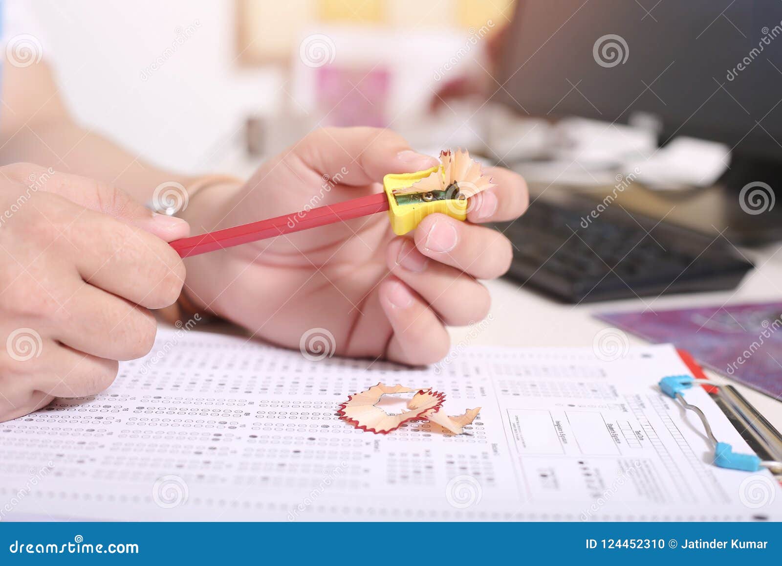 Man Hand Sharpening Pencil with the Help of Sharpener. Picture of OMR ...
