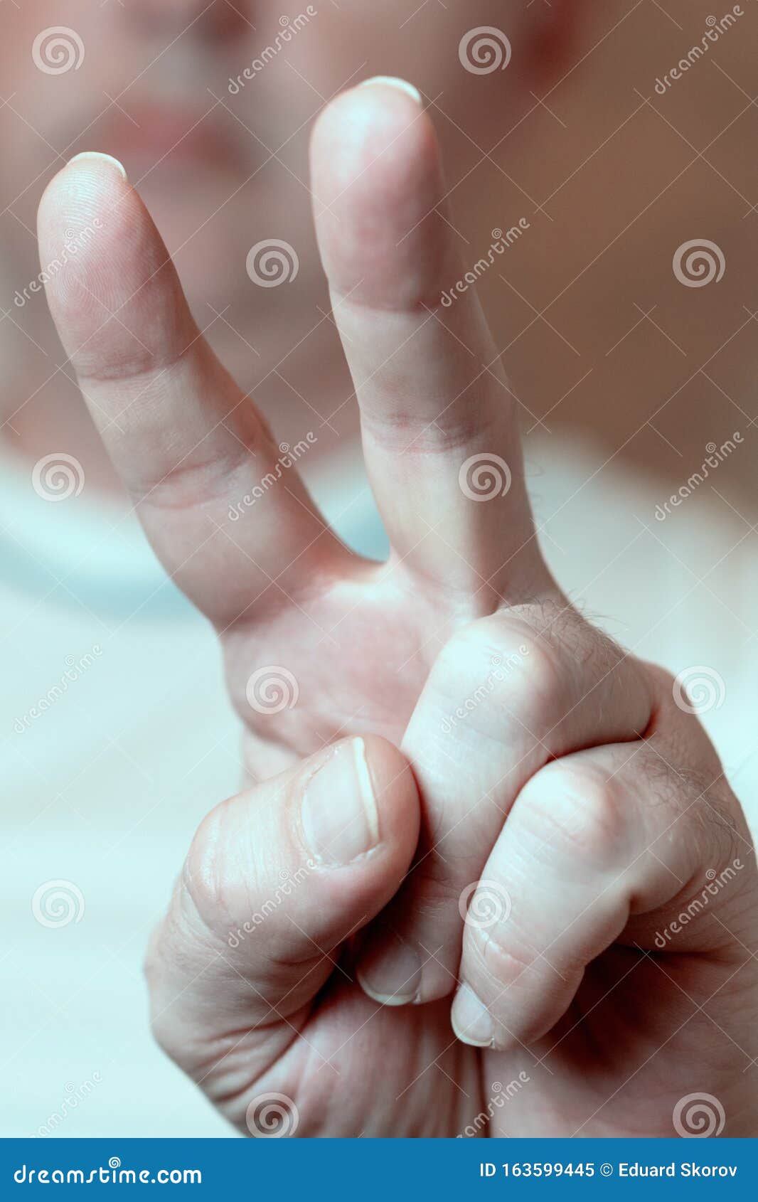 Man Hand Shows Two Finger Displaying Peace and Win Sign. Close-up Stock ...