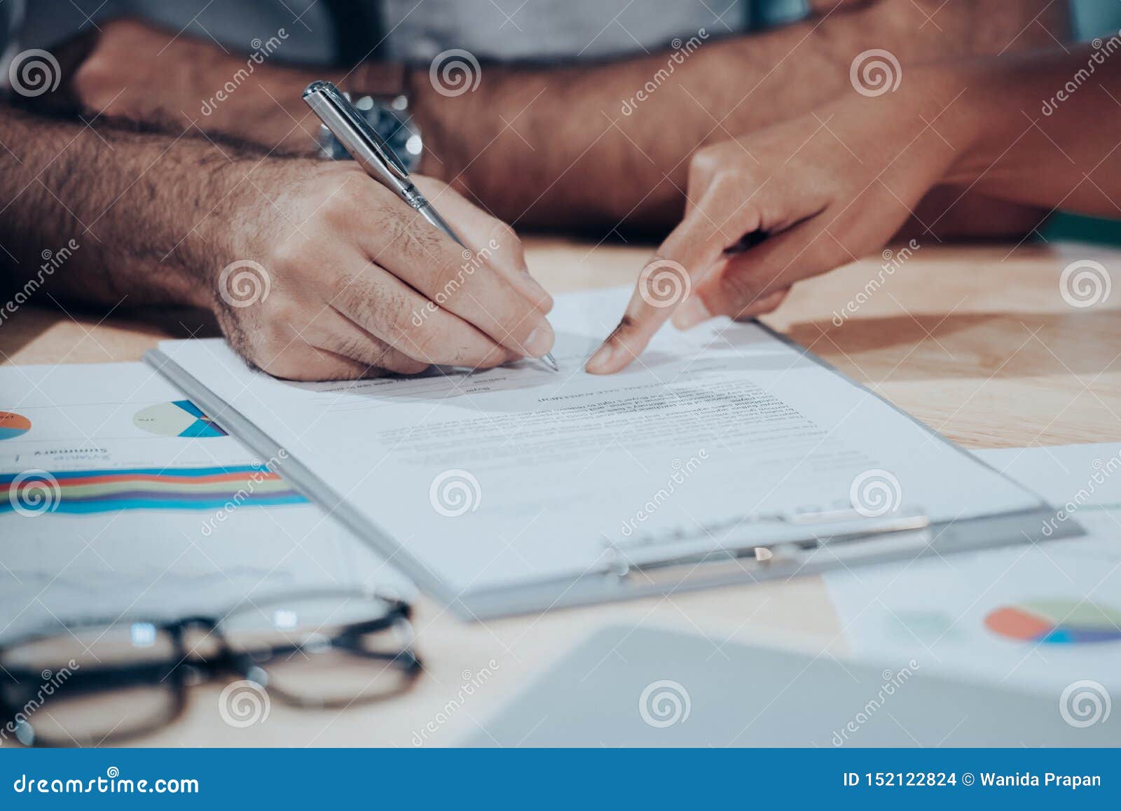 Man Hand Signing a Contract on Document for Building House Economic ...