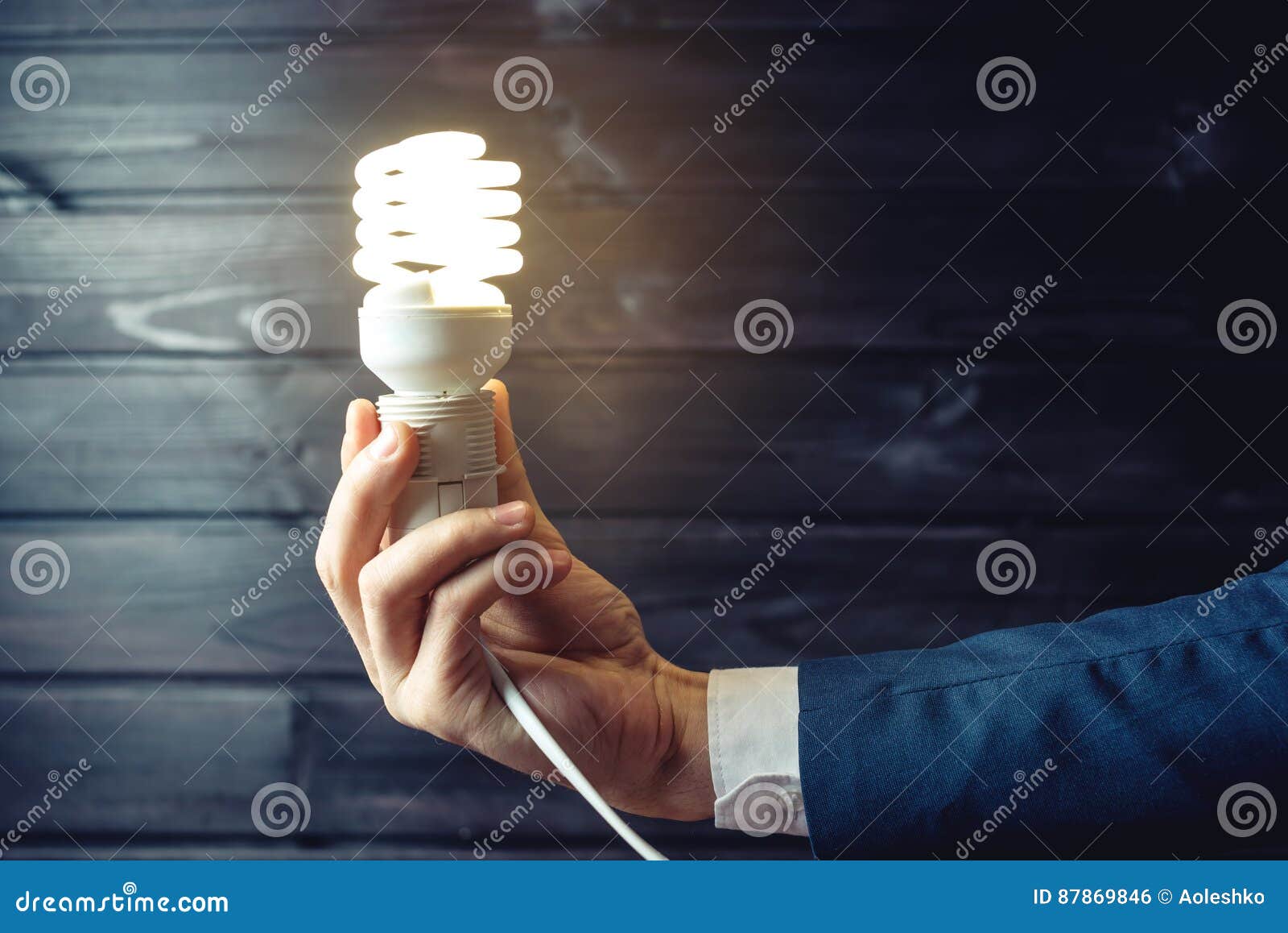 Hand Holds a Glowing Light Bulb. Creative Idea in Business Stock Photo ...