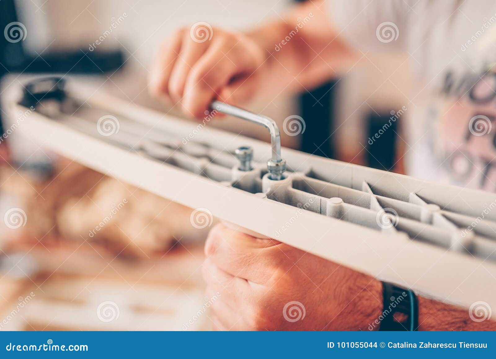 Man assembling a desk stock photo. Image of personal - 101055044