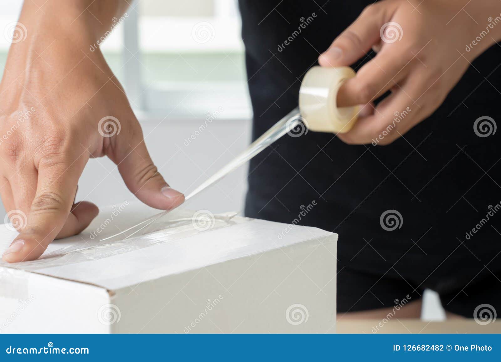 Man Hand Transparent Man Packing Box Adhesive Tape. Stock Photo - Image ...