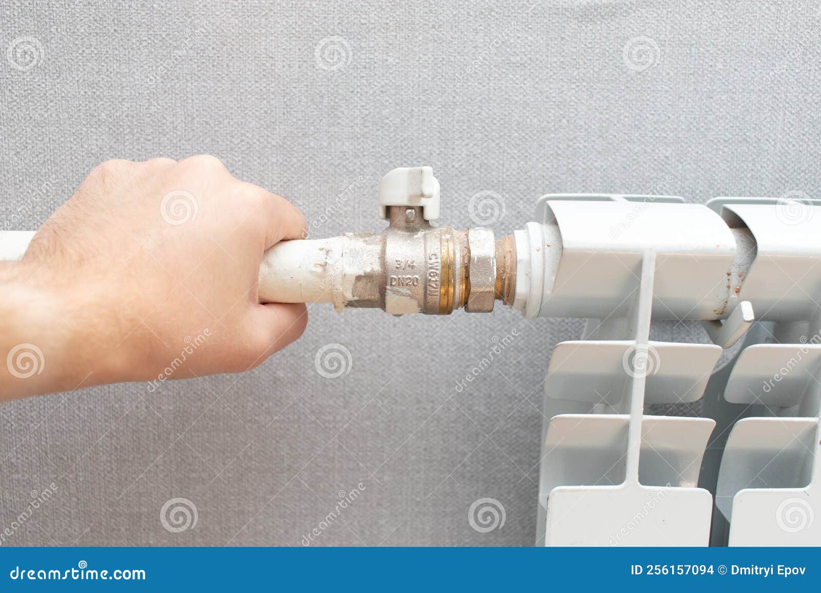 Man Hand on Turn Off Valve of White Radiator Check Temperature ...