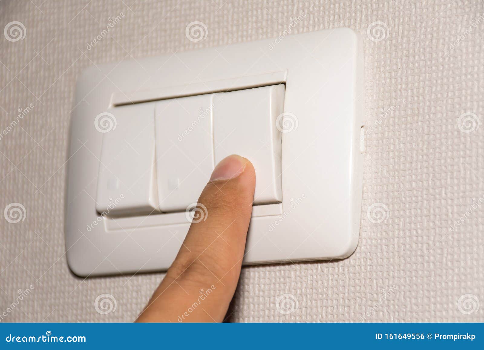 Man Hand is Turning on or Off Electrical Light Switch Stock Photo ...