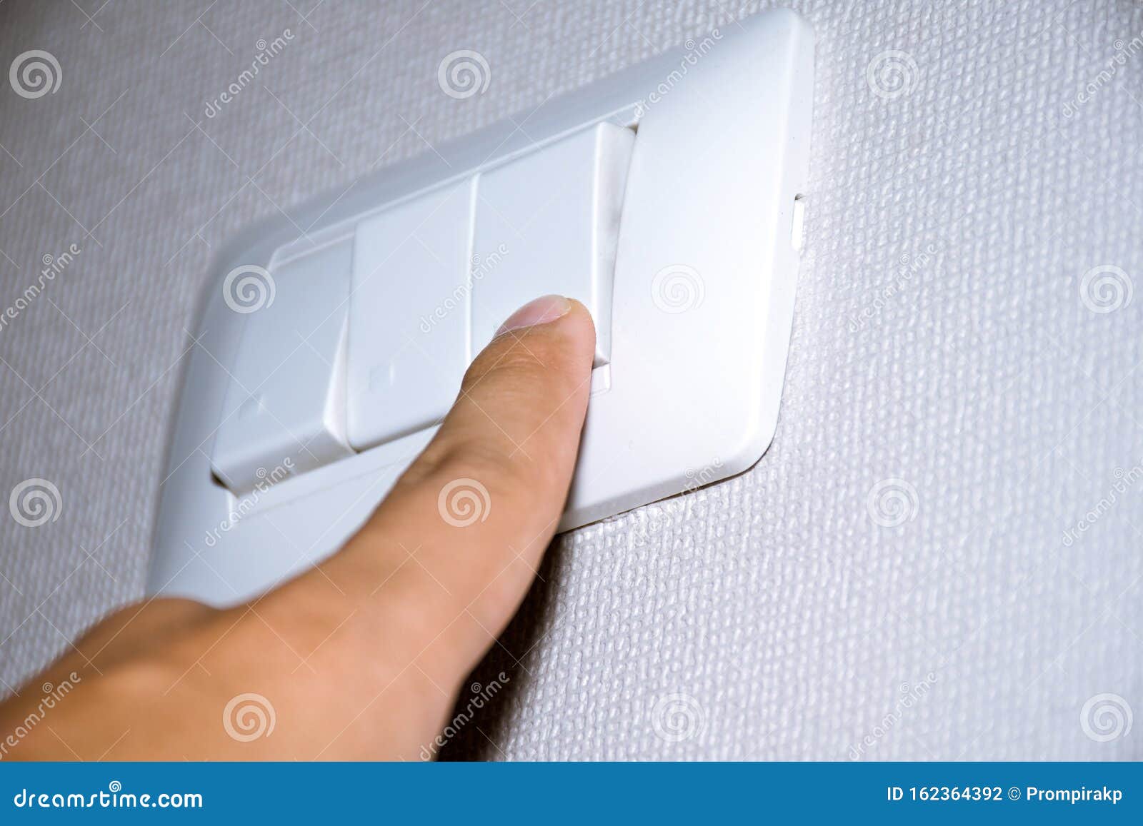 Man Hand is Turning on or Off Electrical Light Switch Stock Photo ...