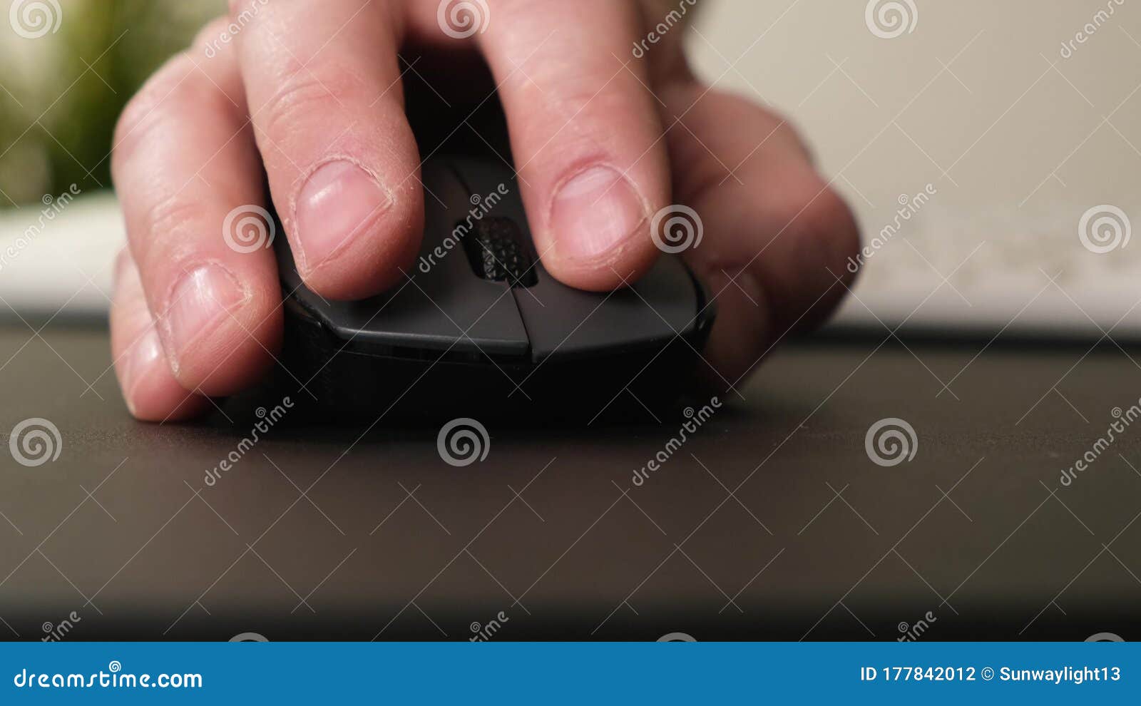 Man Hand Uses Black Wireless Mouse on Table. Close Up. Stock Photo ...