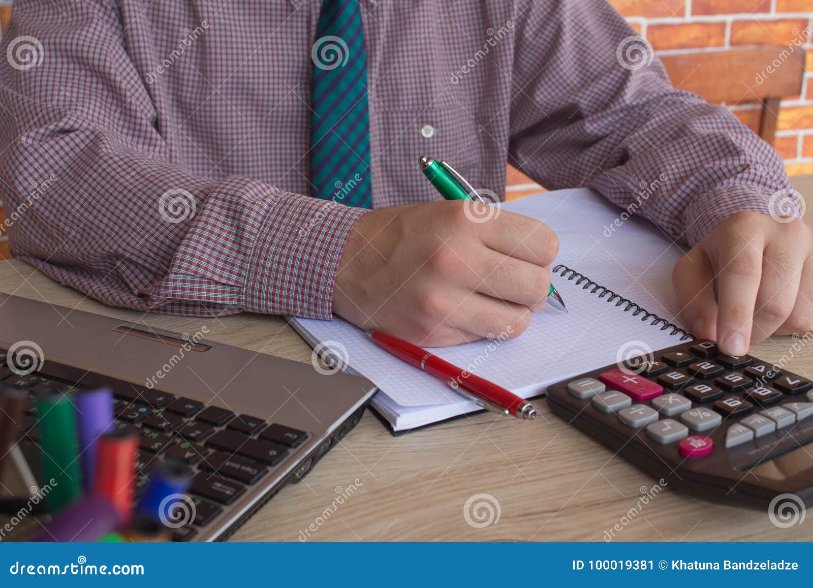 Man Hand Using Calculator and Writing Make Note with Calculate about ...