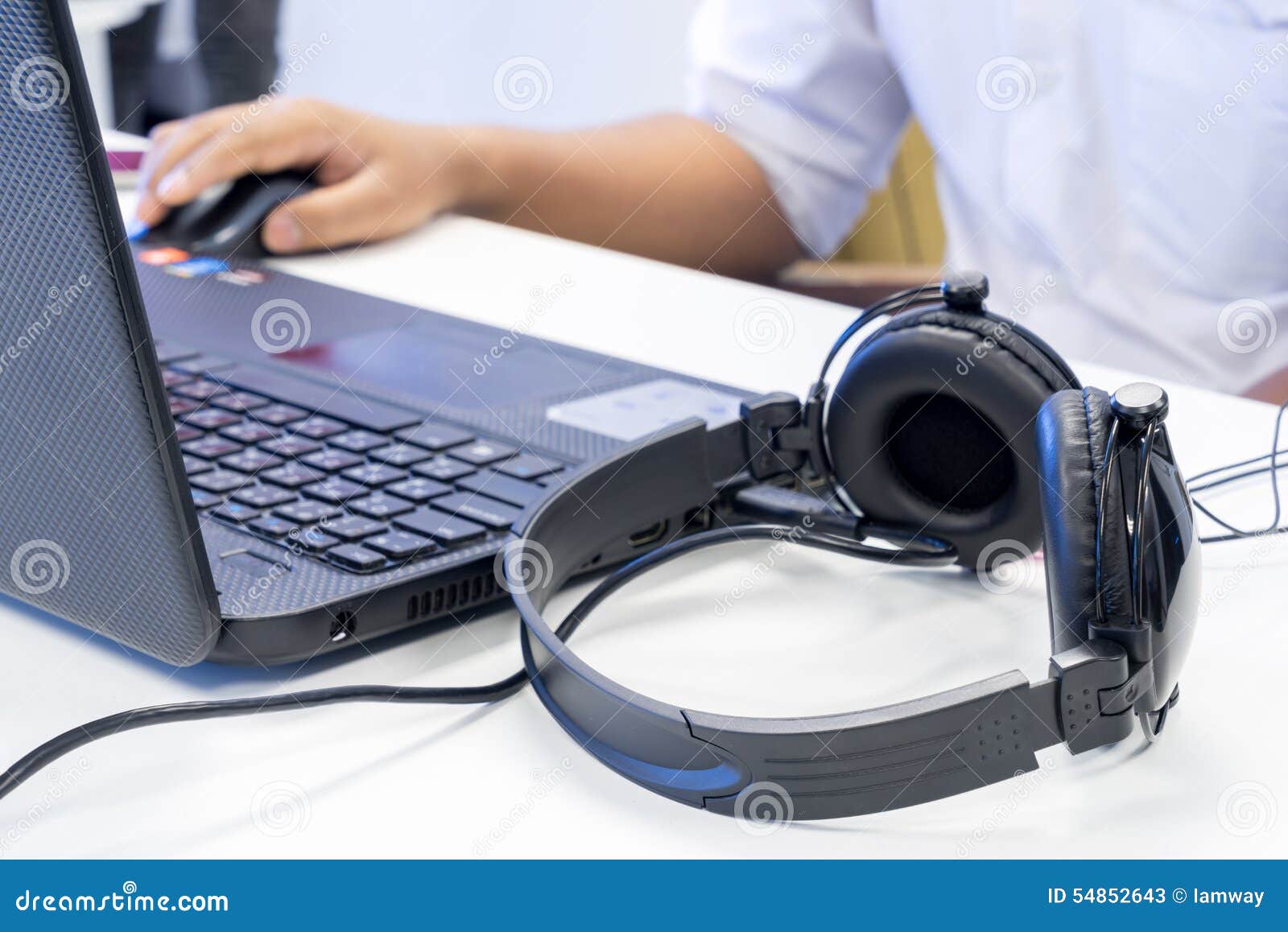 Man Hand Using Keyboard and Mouse To Control Laptop with Headphone ...