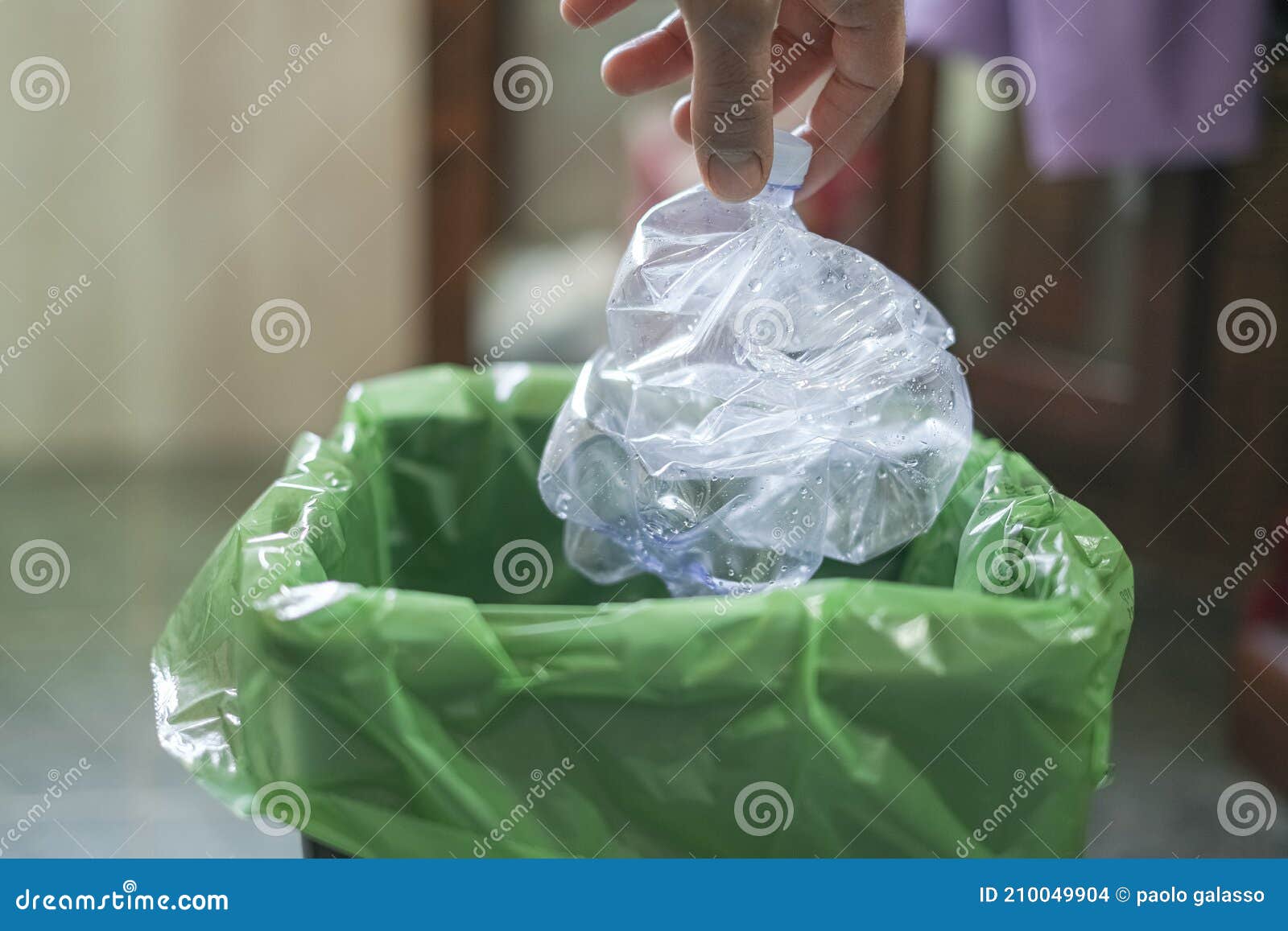 Man Hand View while Trashing Used Plastic Bottle on Separate Garbage ...