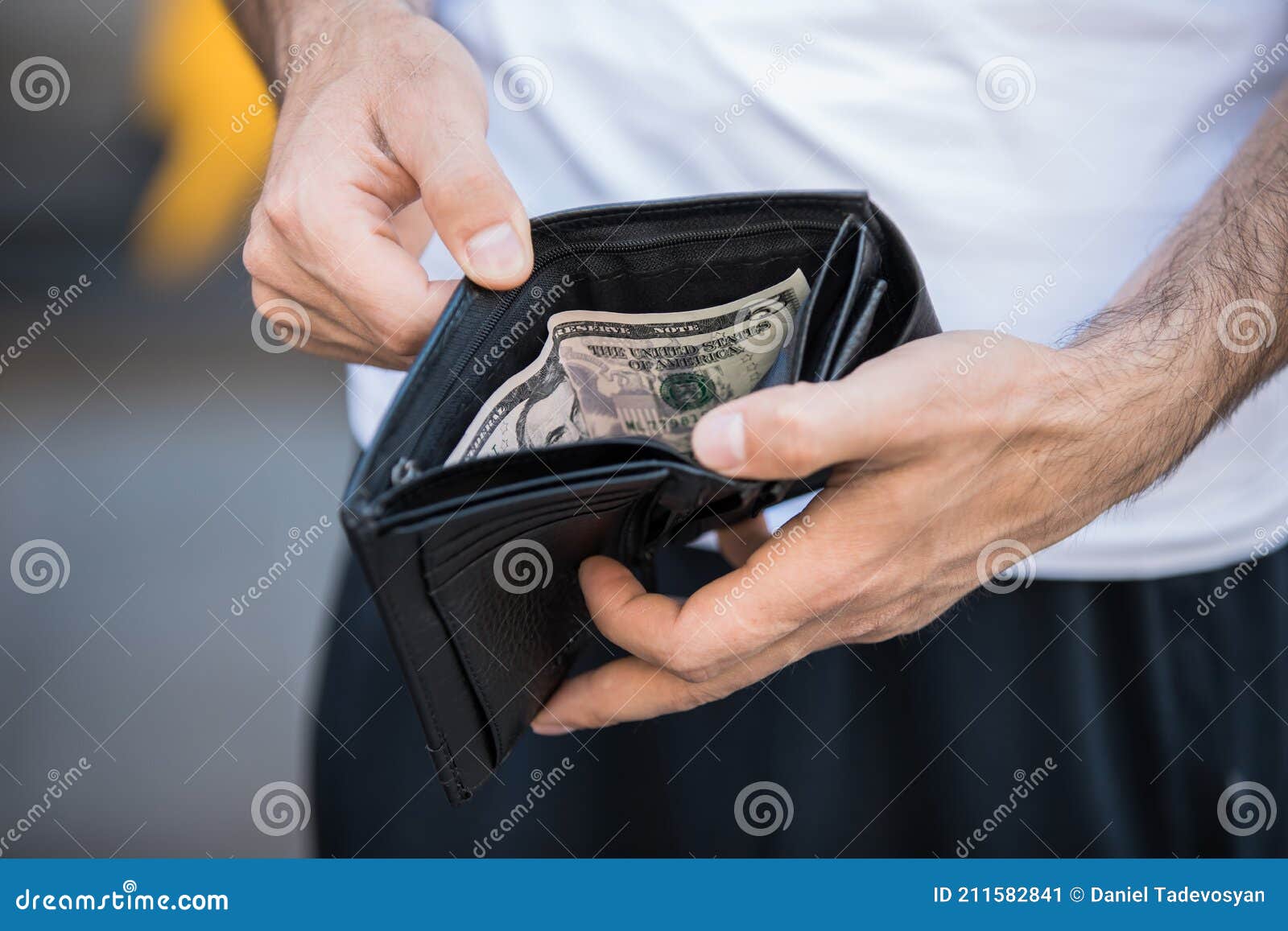 Man hand wallet in street stock image. Image of purse - 211582841