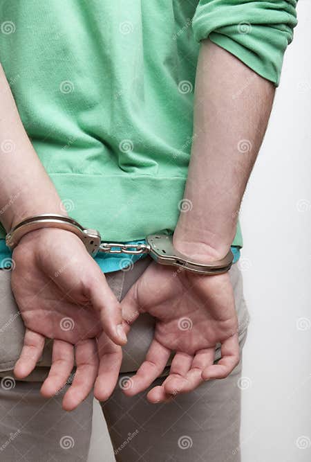 Man handcuffed behind back stock photo. Image of criminal - 12449874