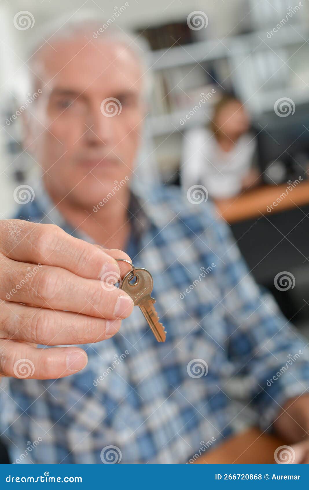 Man handing over house key stock photo. Image of executive - 266720868