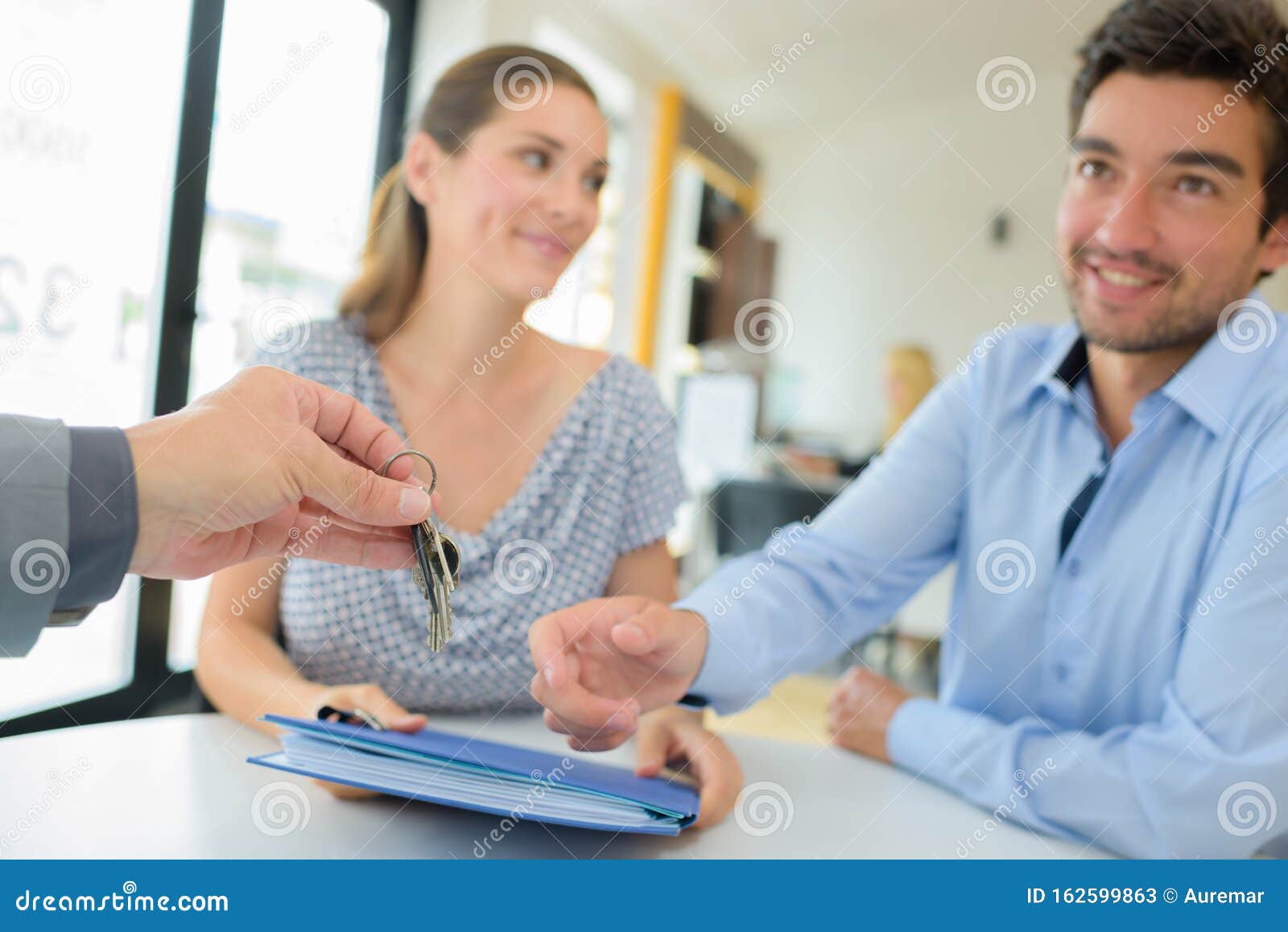 Man handing over keys stock image. Image of female, rental - 162599863