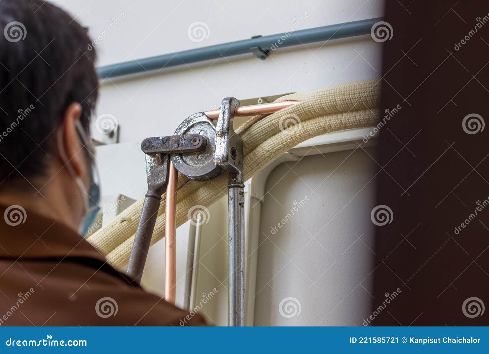 Man Hands Bends Copper Pipes by Pipe Bender. Air Conditioner Technician ...